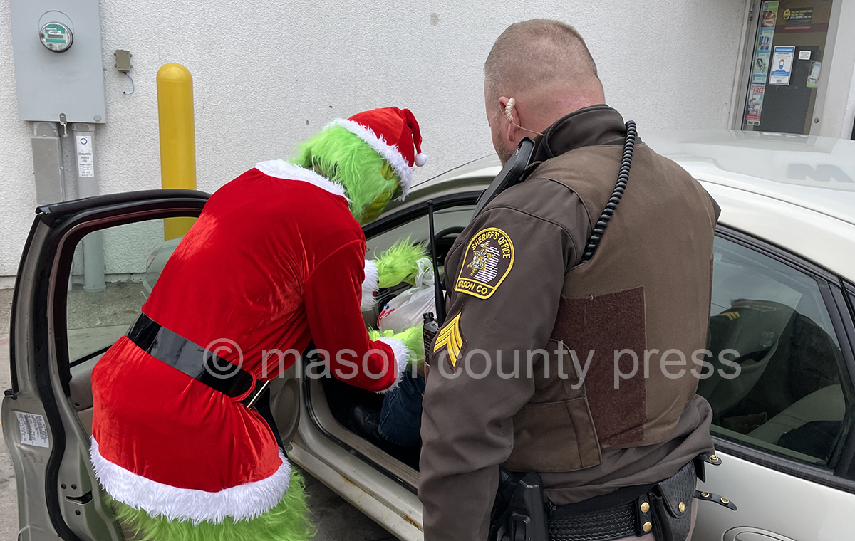 The Grinch hands out hams as part of release agreement ...