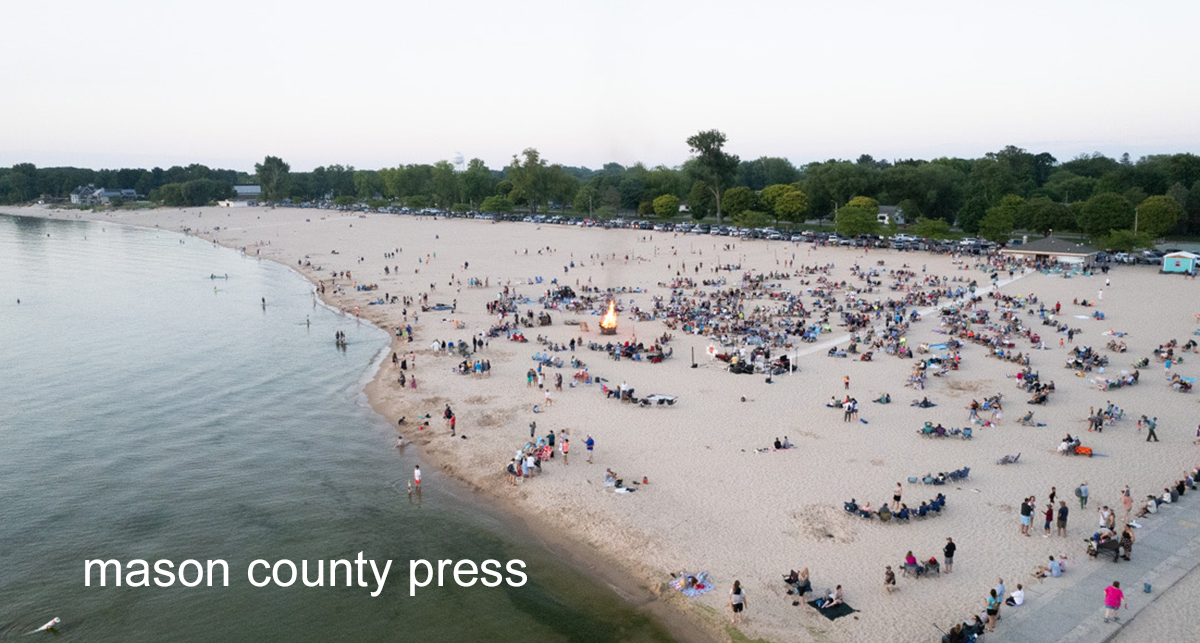 Beach goers rescue teenager who nearly drowned in Lake Michigan ...